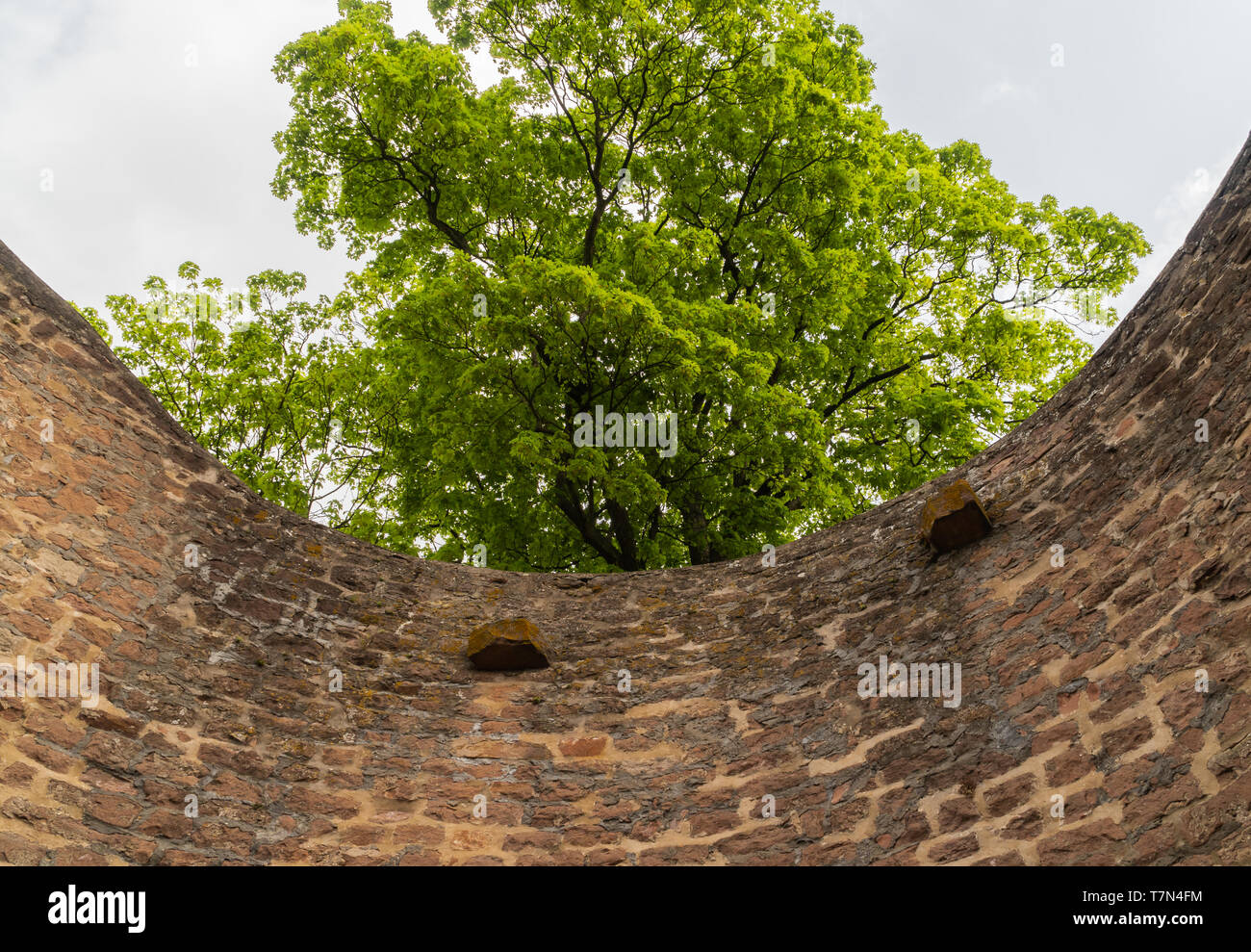 A historic, stone tower. Medieval castle. A fragment of the castle ...