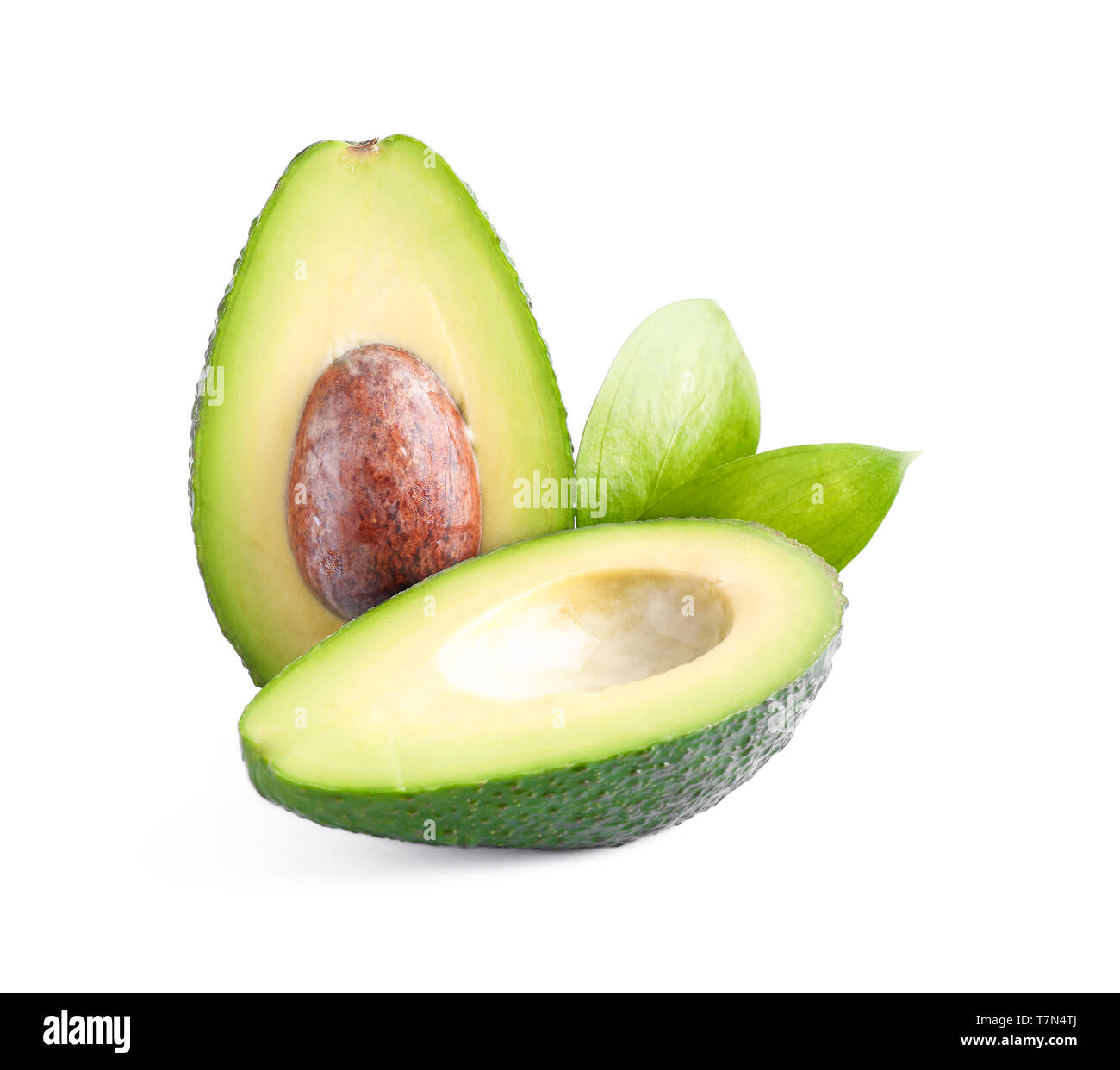 Ripe cut avocado with leaves isolated on white background. Healthy food ...