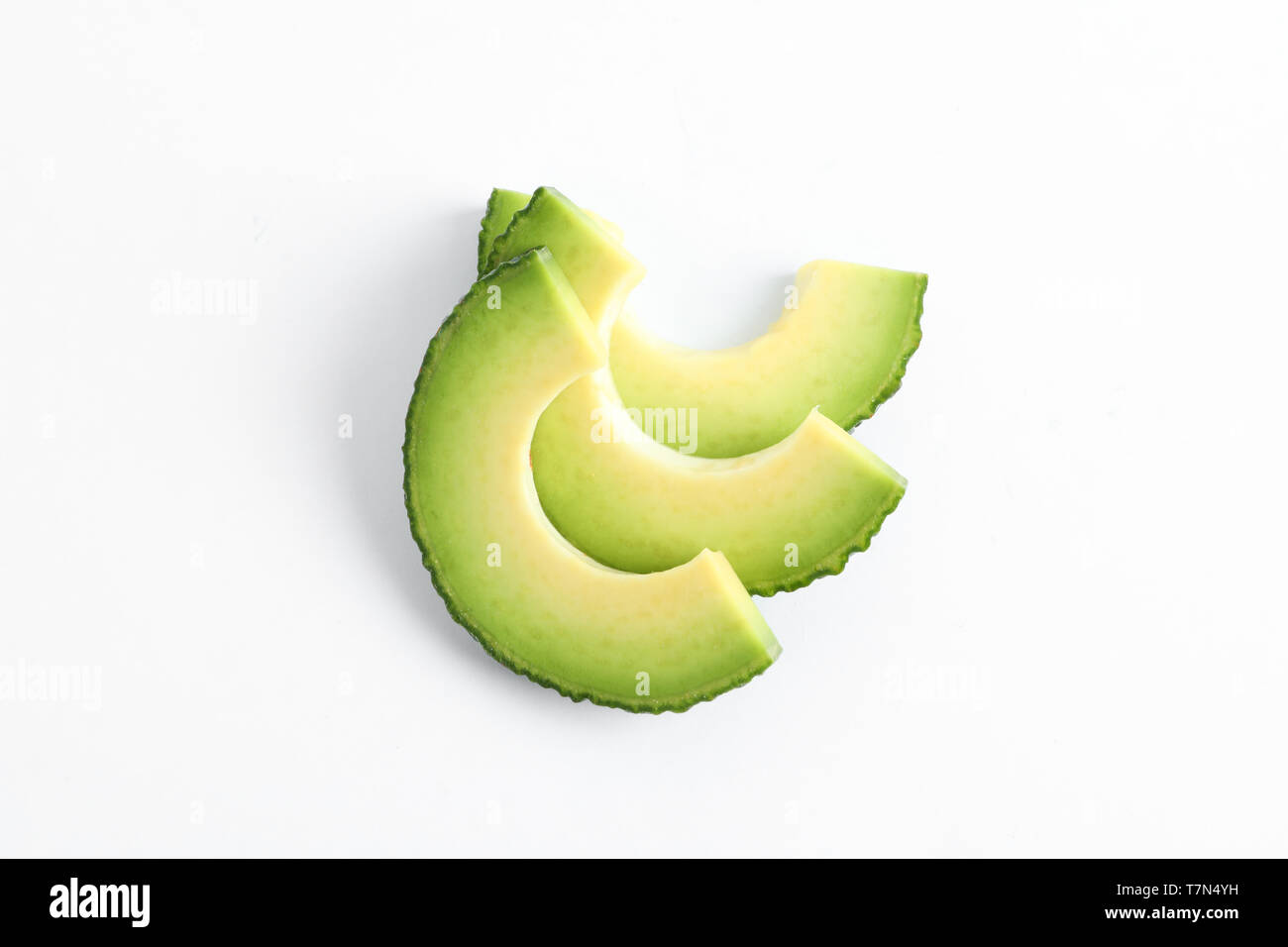 Fresh avocado slices on white background, space for text. Top view ...