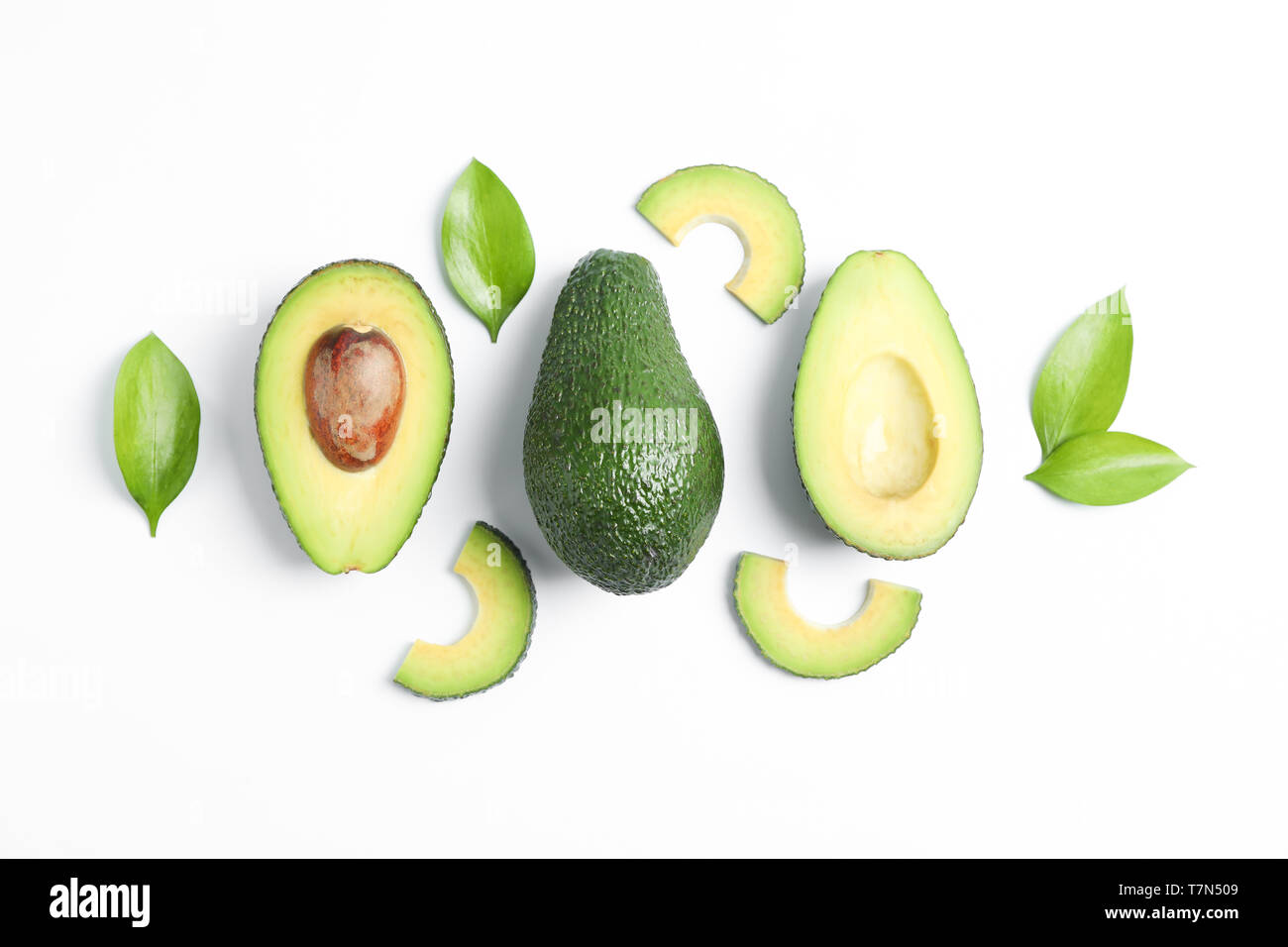 Flat lay composition with ripe avocados on white background, space for ...