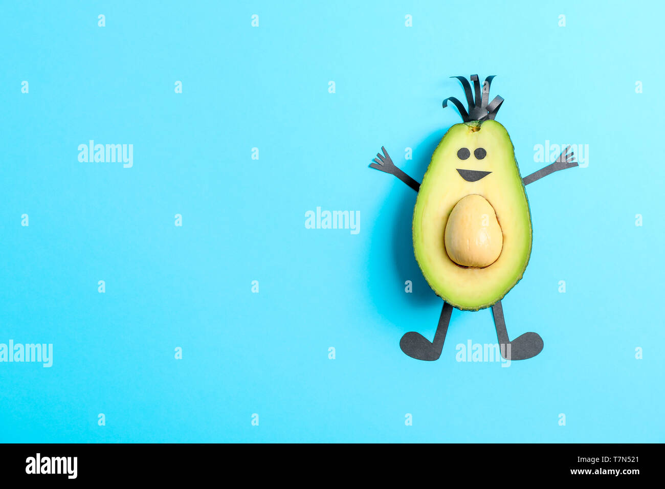 Happy avocado on color background, space for text Stock Photo - Alamy