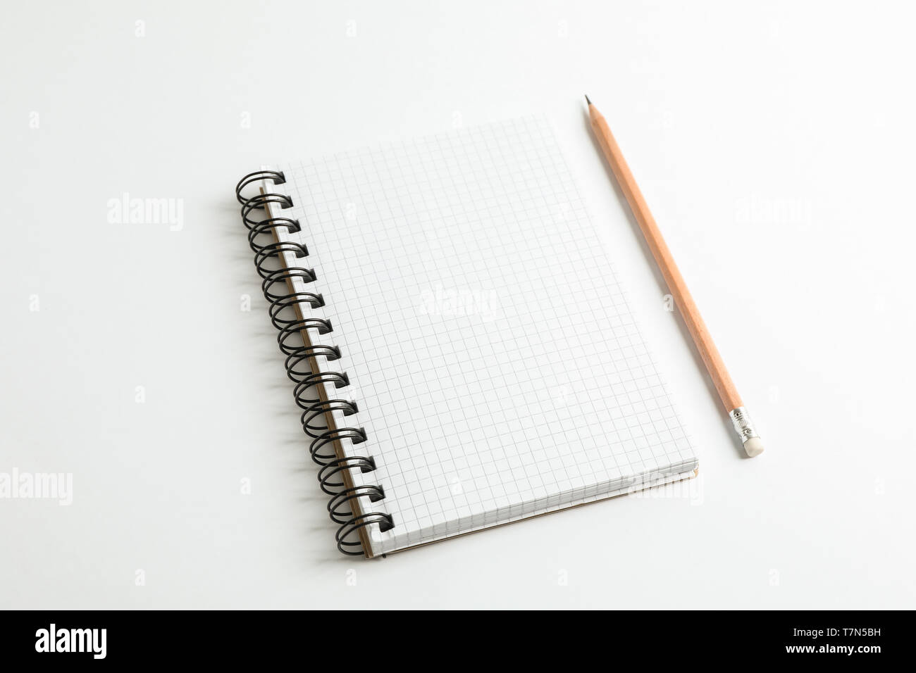 Clean copybook with pencil on white background, space for text Stock ...