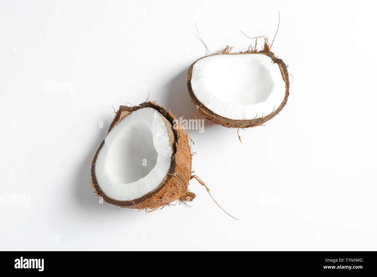 Split tropical coconut isolated on white background Stock Photo - Alamy