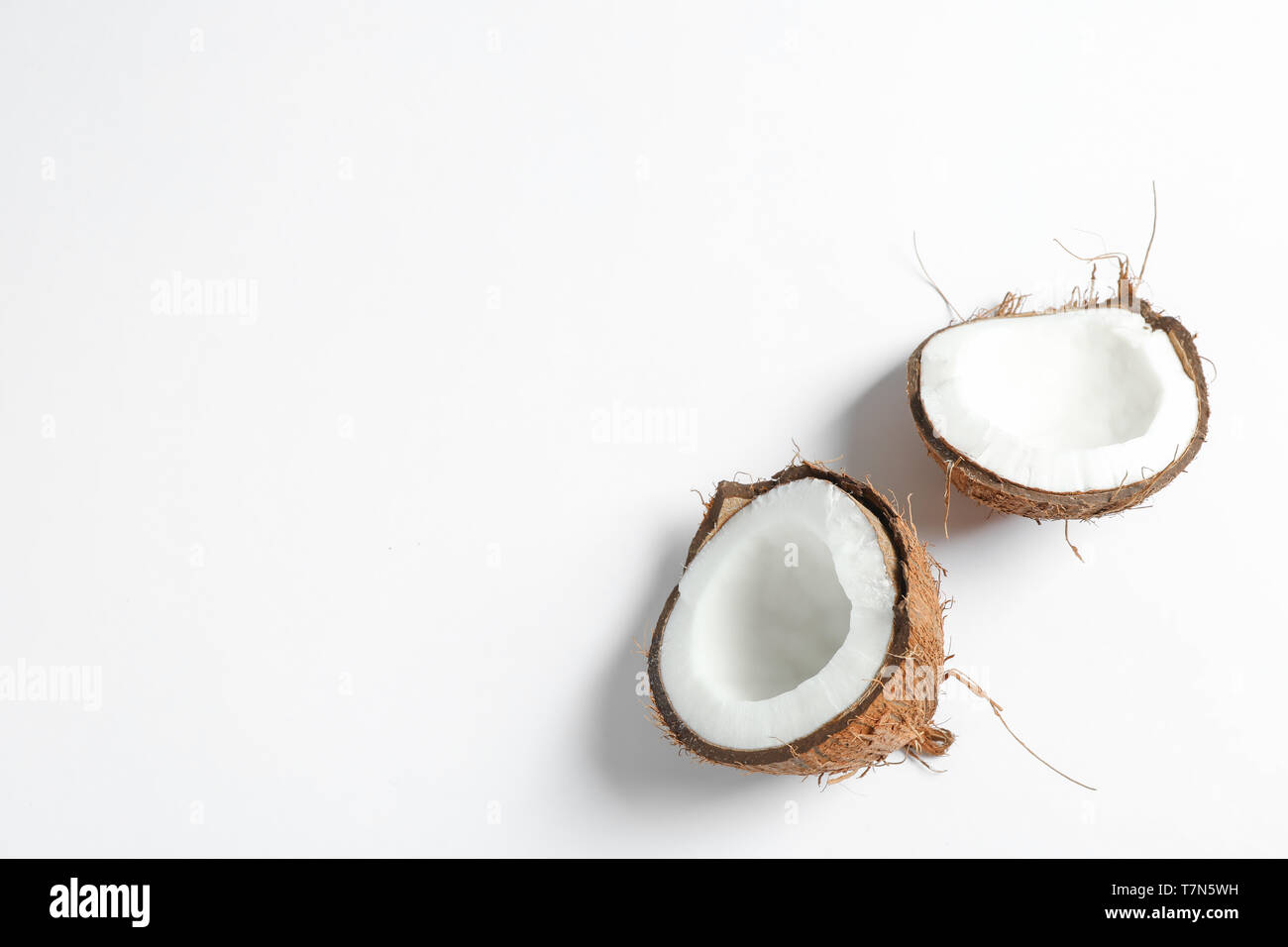 Split tropical coconut isolated on white background Stock Photo - Alamy
