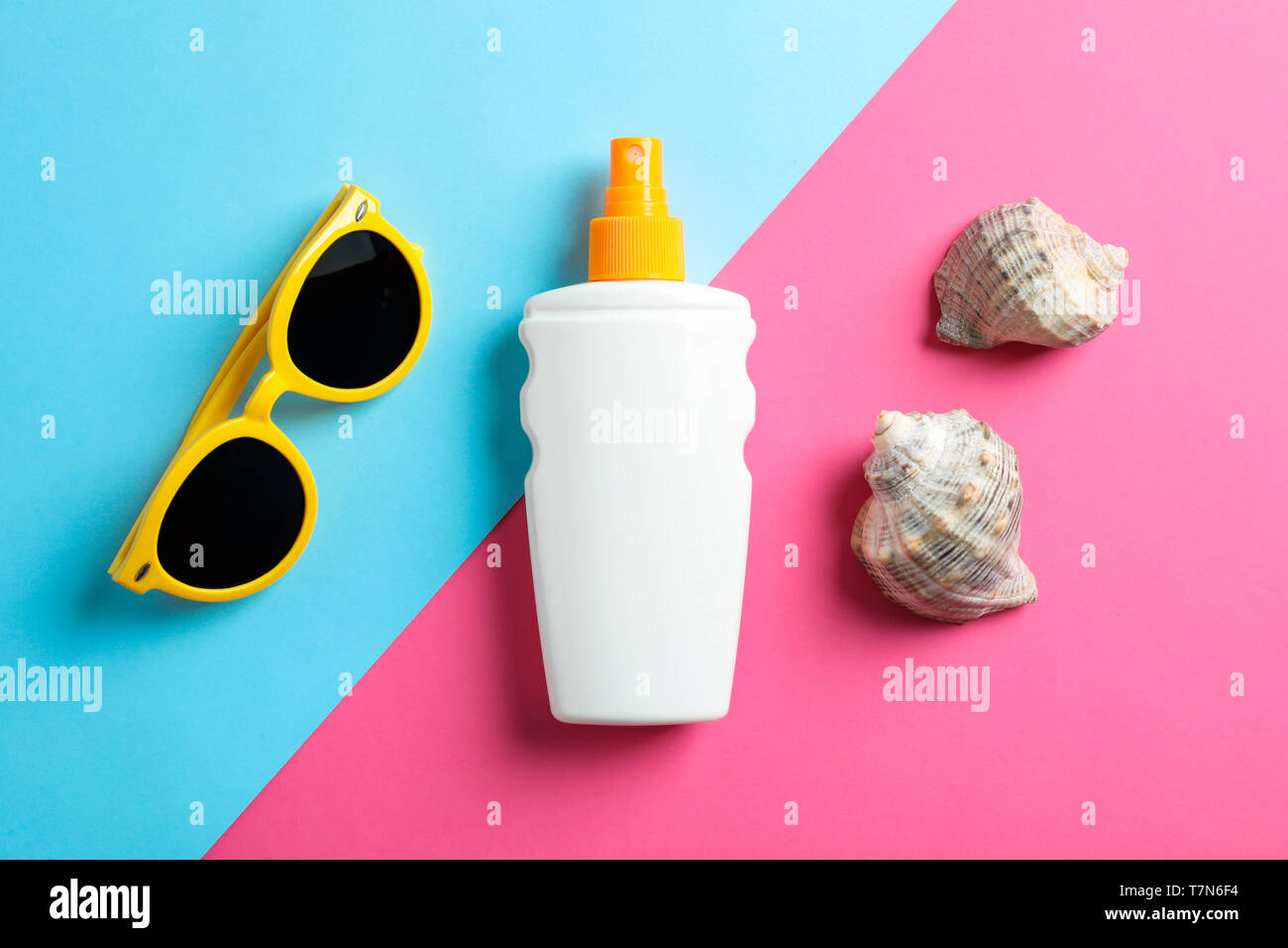 Flat lay composition with sunglasses, sunscreen pray and seashell on ...