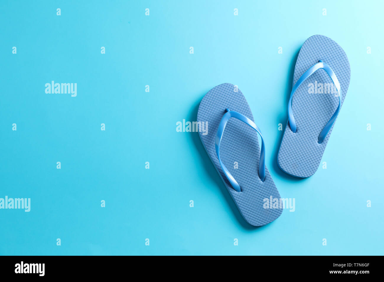 Flip flops on color background, space for text. Summer vacation ...