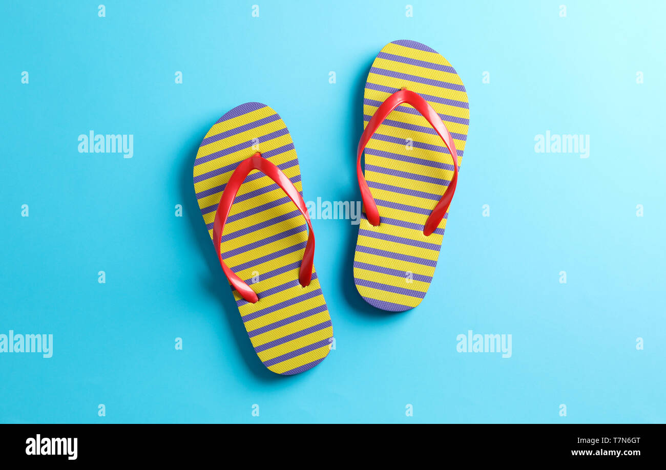 Flip flops on color background, space for text. Summer vacation ...