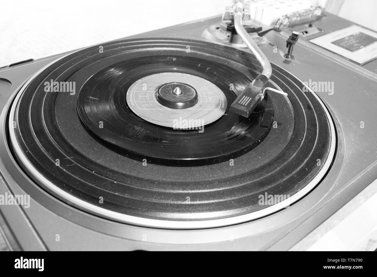 This is and old and antique turntable captured in black and white and ...
