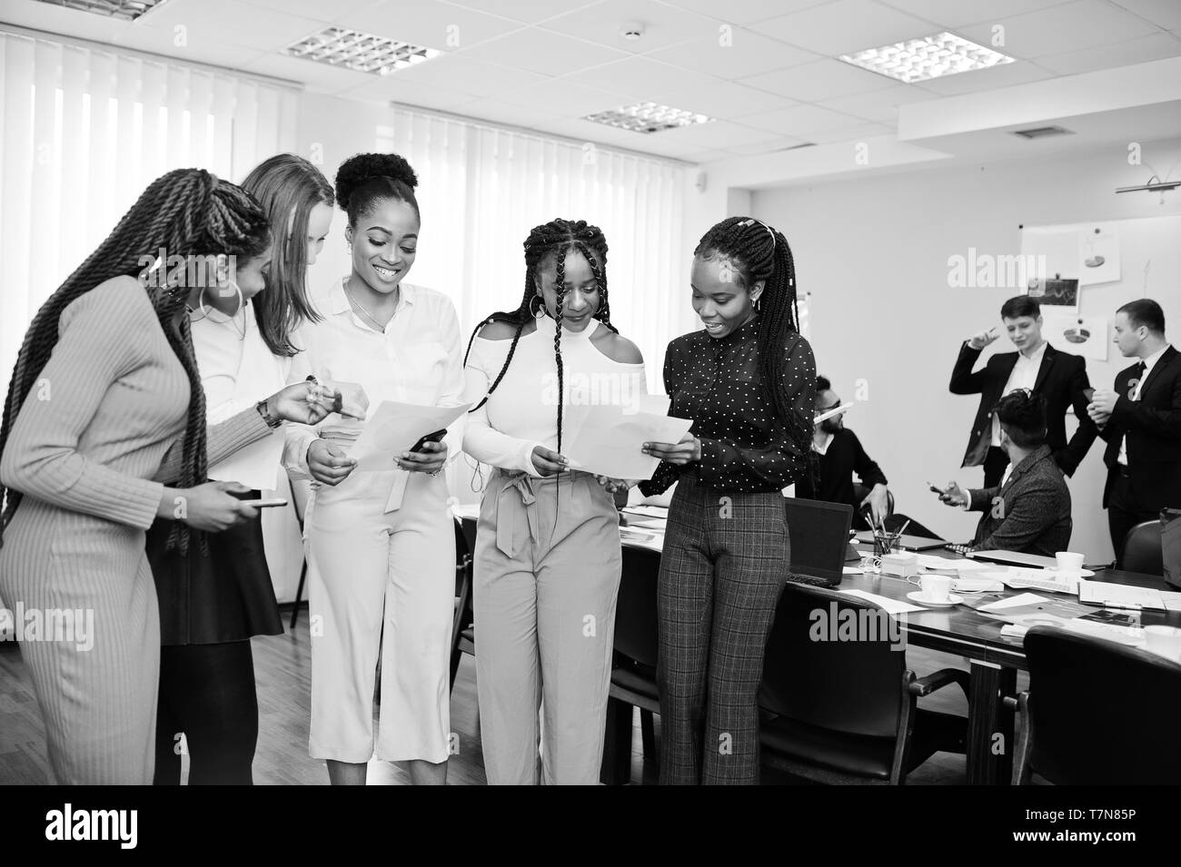 Diverse business people on a meeting at round table Stock Photo - Alamy