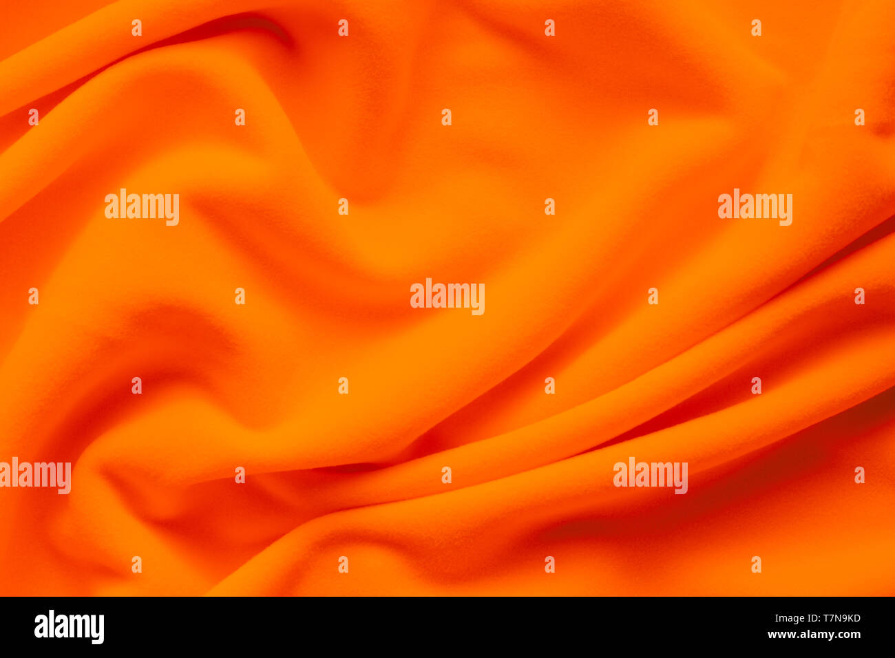 Background texture of orange fleece, soft napped insulating fabric made ...