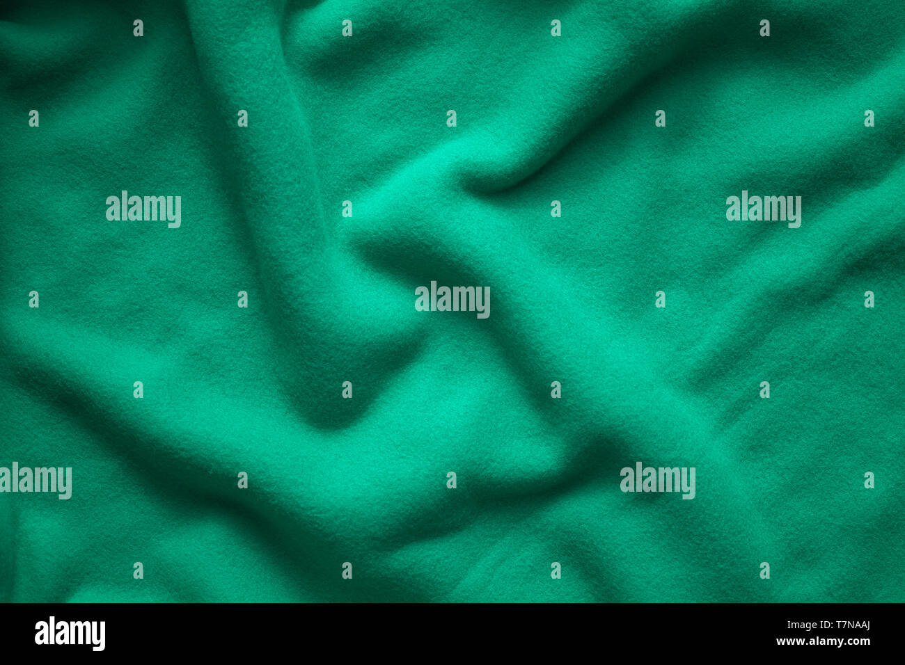 Background texture of green fleece, soft napped insulating fabric made ...
