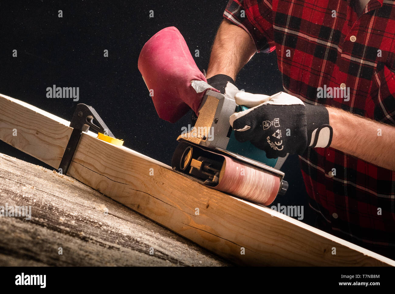 Carpenter works with electrical planer hi-res stock photography and ...