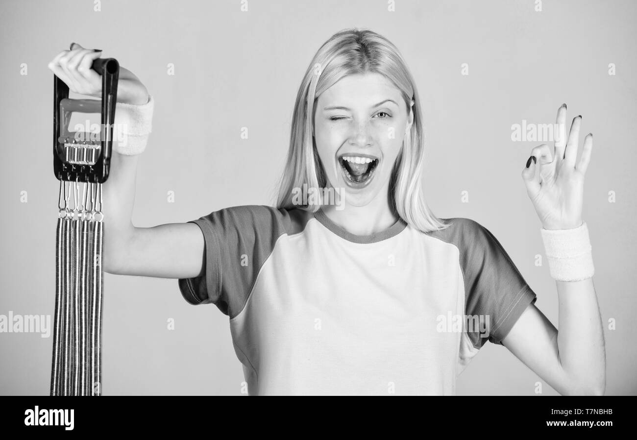 Woman exercising chest expander hi-res stock photography and images - Alamy