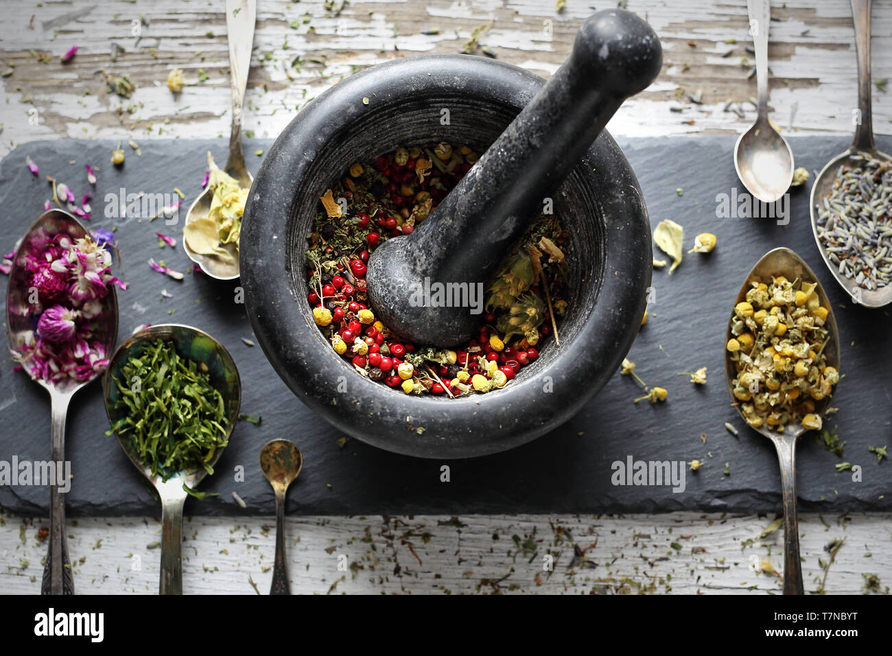 Composition of dried herbs. Aromatic mixture grated in mortar ...