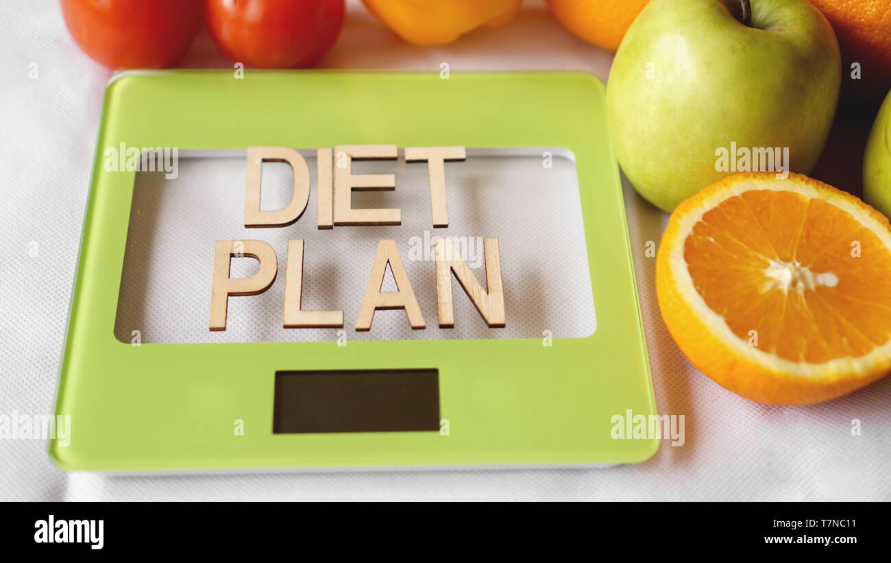 Concept diet. Healthy food, kitchen weight scale. Vegetables and fruits ...