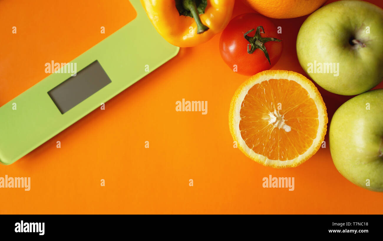 Concept diet. Healthy food, kitchen weight scale. Vegetables and fruits ...
