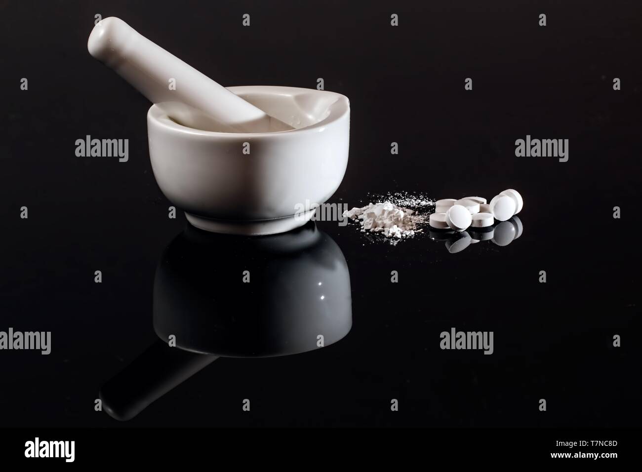 White porcelain mortar and pestle for mixing medicine in the pharmacy ...