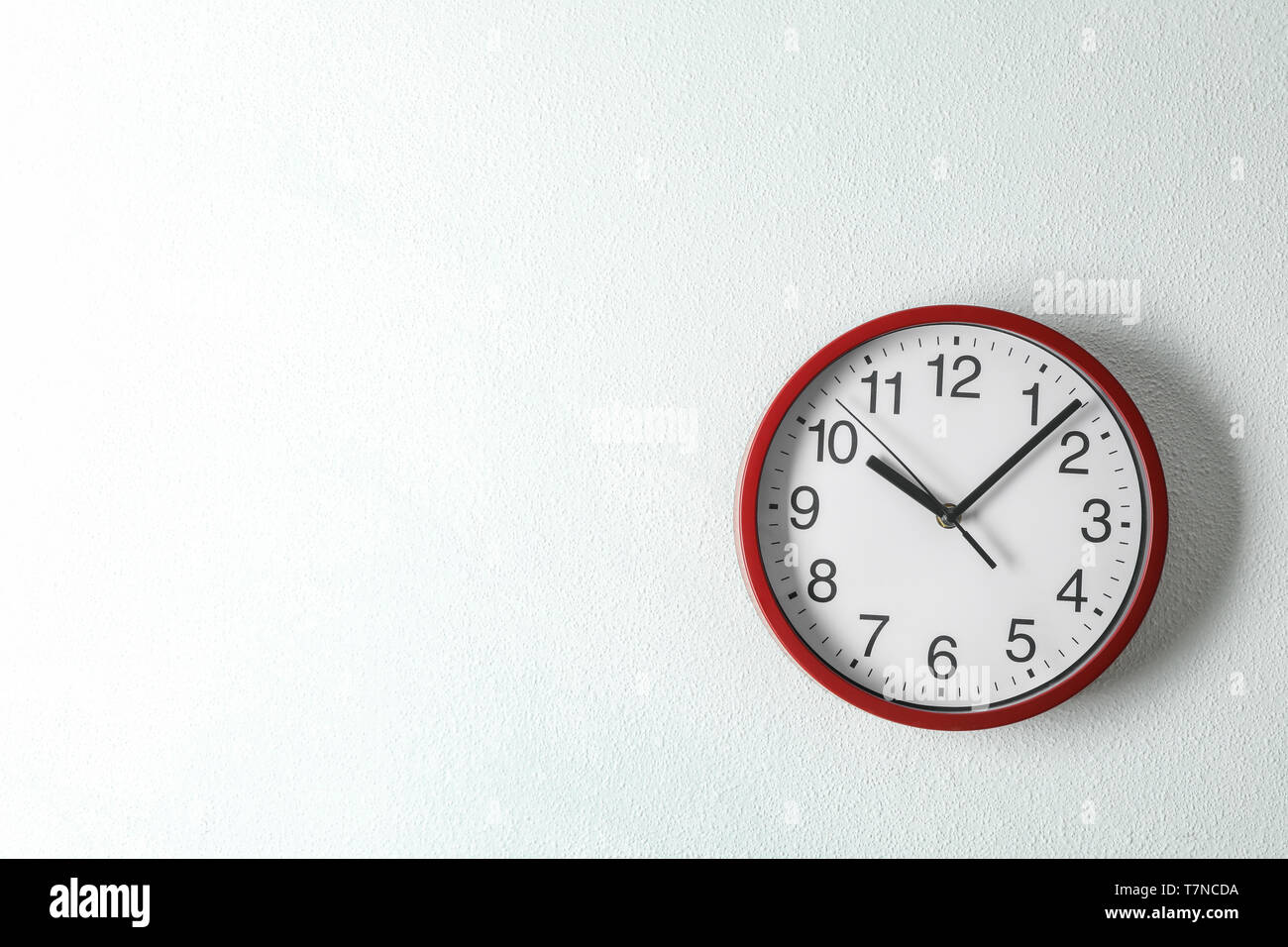 Big beautiful clock hanging on light background, space for text Stock ...