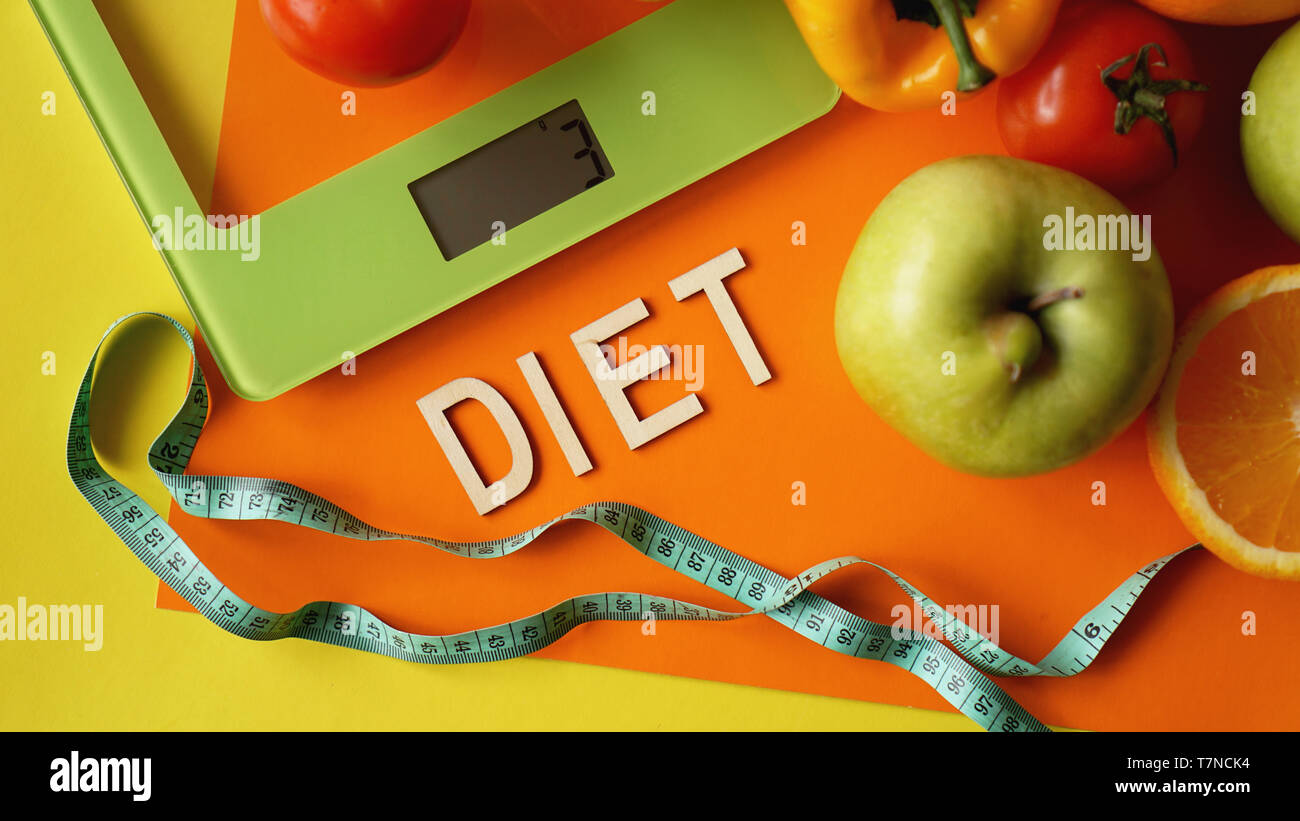 Concept diet. Healthy food, kitchen weight scale. Vegetables and fruits ...