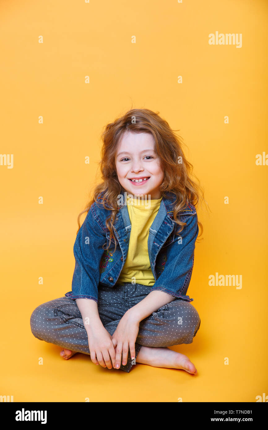 Adorable kid sitting crossed legs hi-res stock photography and images ...
