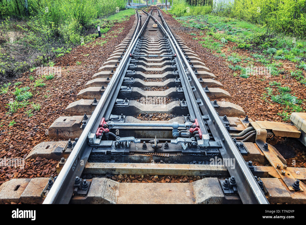 Railway tracks on the big station at day time Stock Photo - Alamy