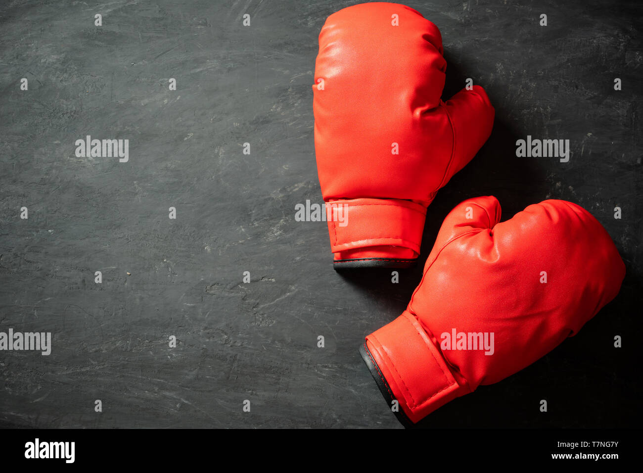 Boxing Gloves on black cement background. Concept of fighting or boxing ...