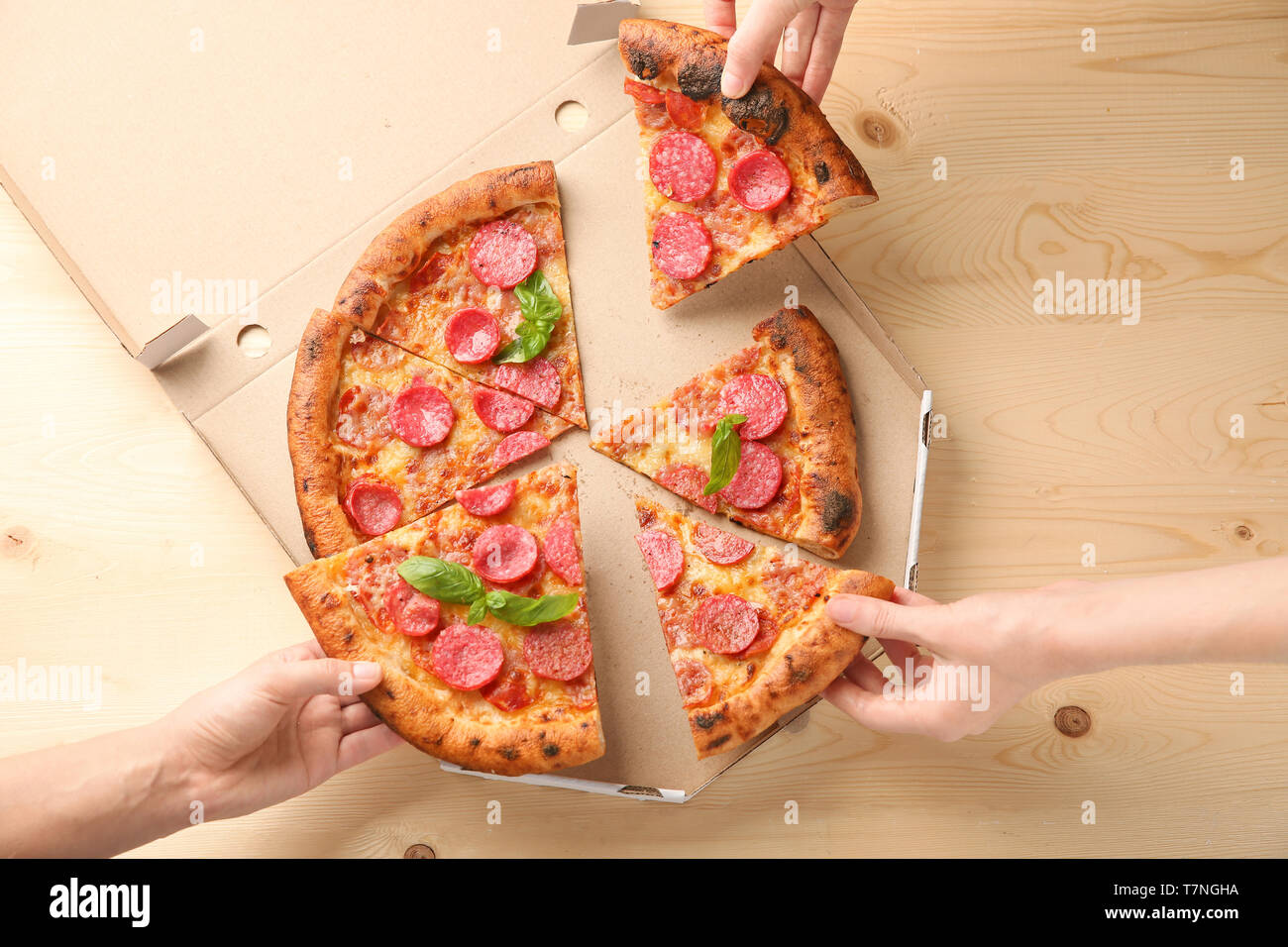 Taking pizza slices hi-res stock photography and images - Alamy