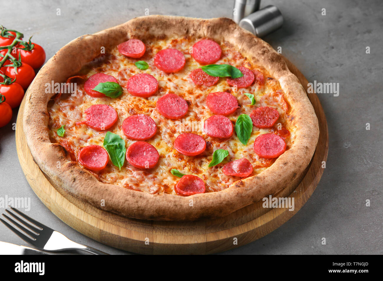 Delicious Italian pizza on table Stock Photo - Alamy