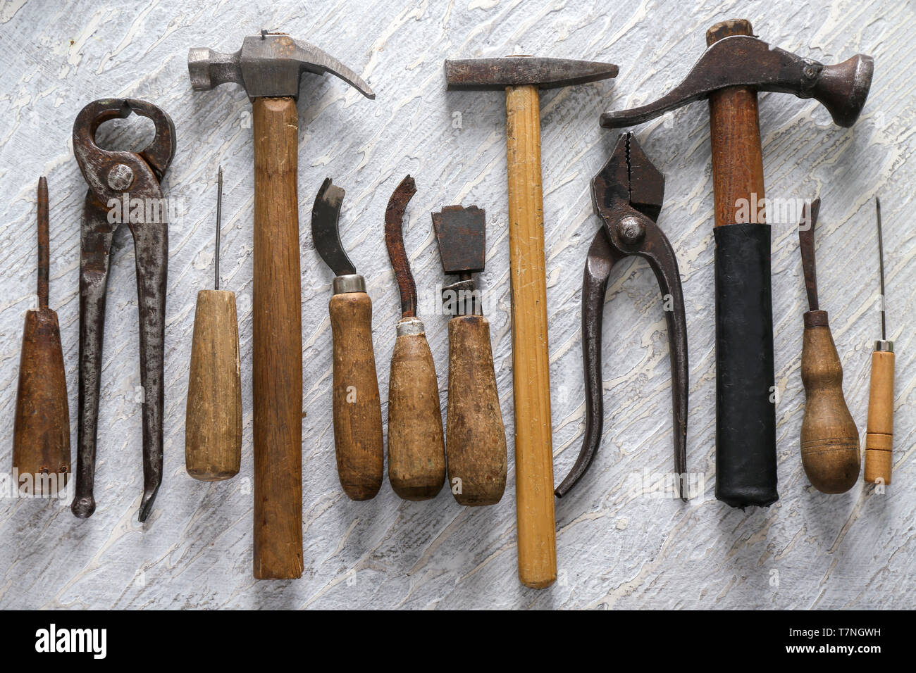 Craft tools on table in leather workshop Stock Photo - Alamy