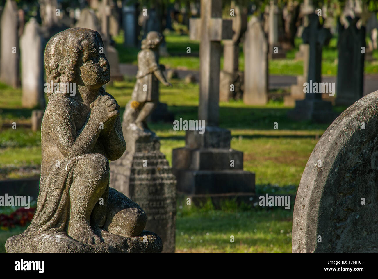 The ancient statue of the boy is asking for blessings from God in the ...