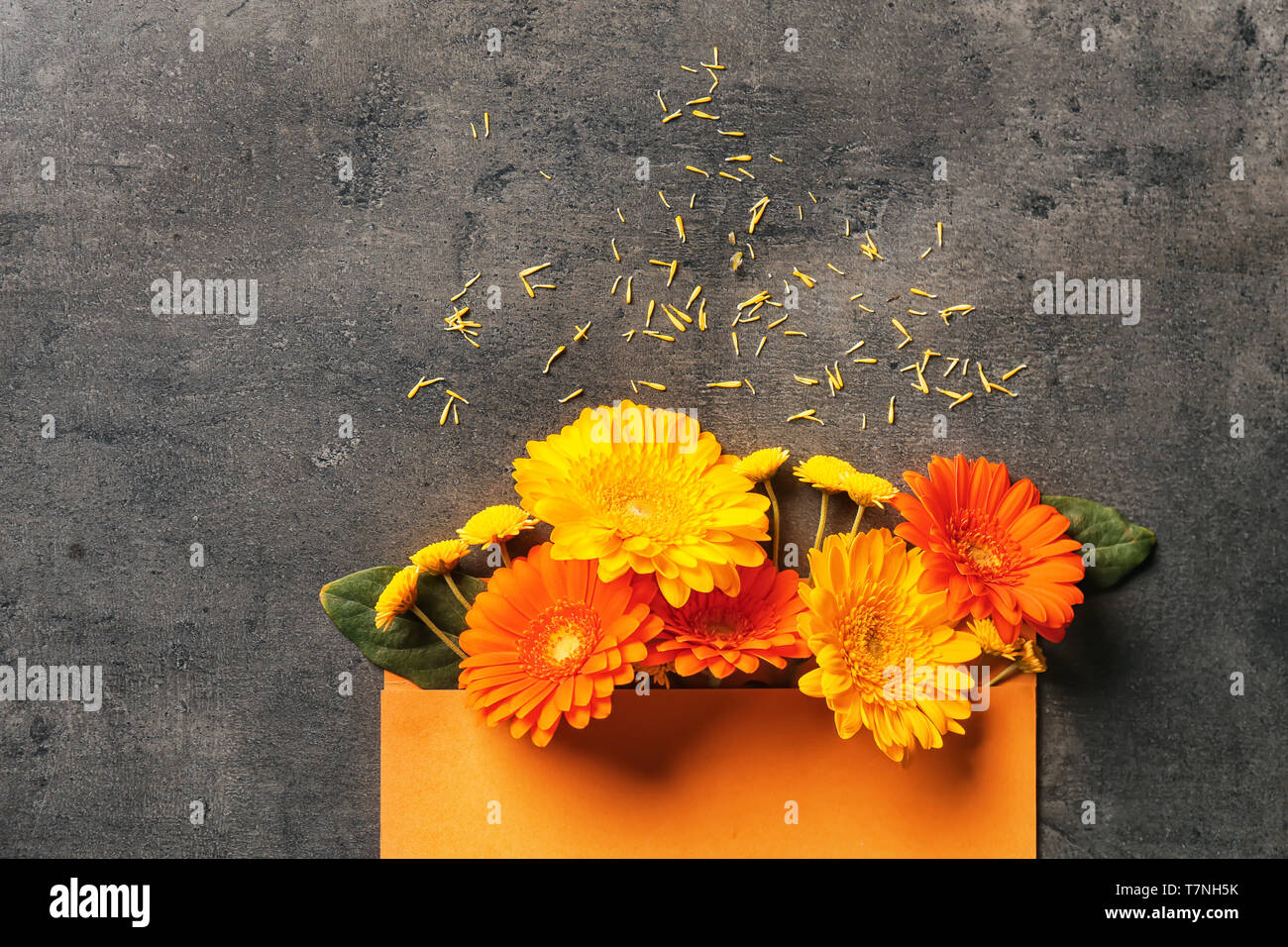 Open mail envelope with flowers on grey background Stock Photo - Alamy