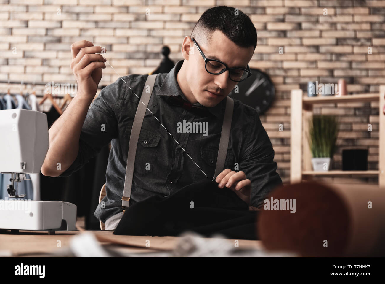 Man sitting in tailoring workshop hi-res stock photography and images ...