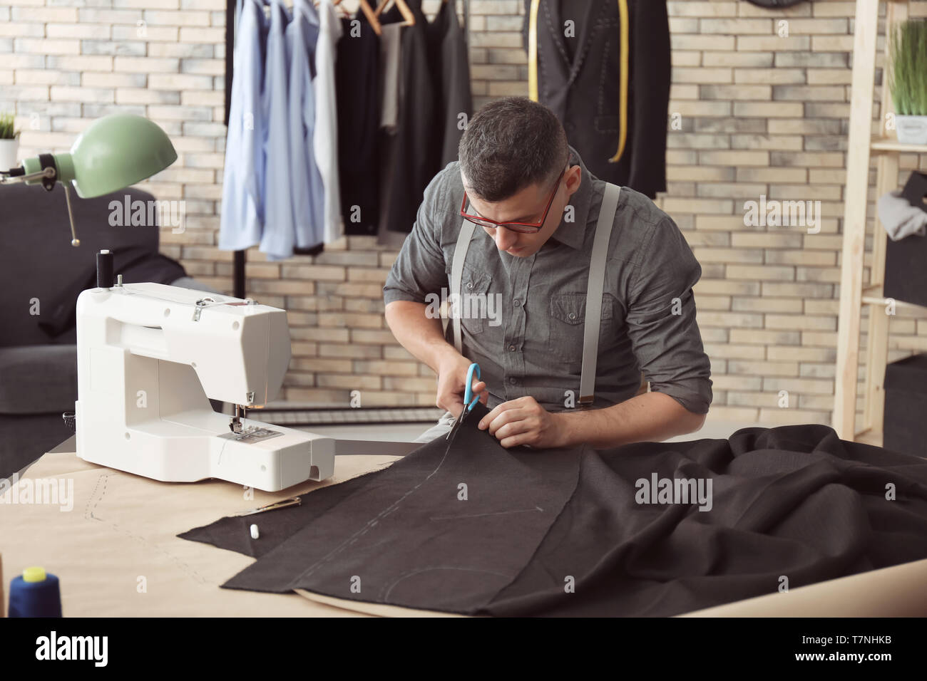Tailor cutting suit hi-res stock photography and images - Alamy