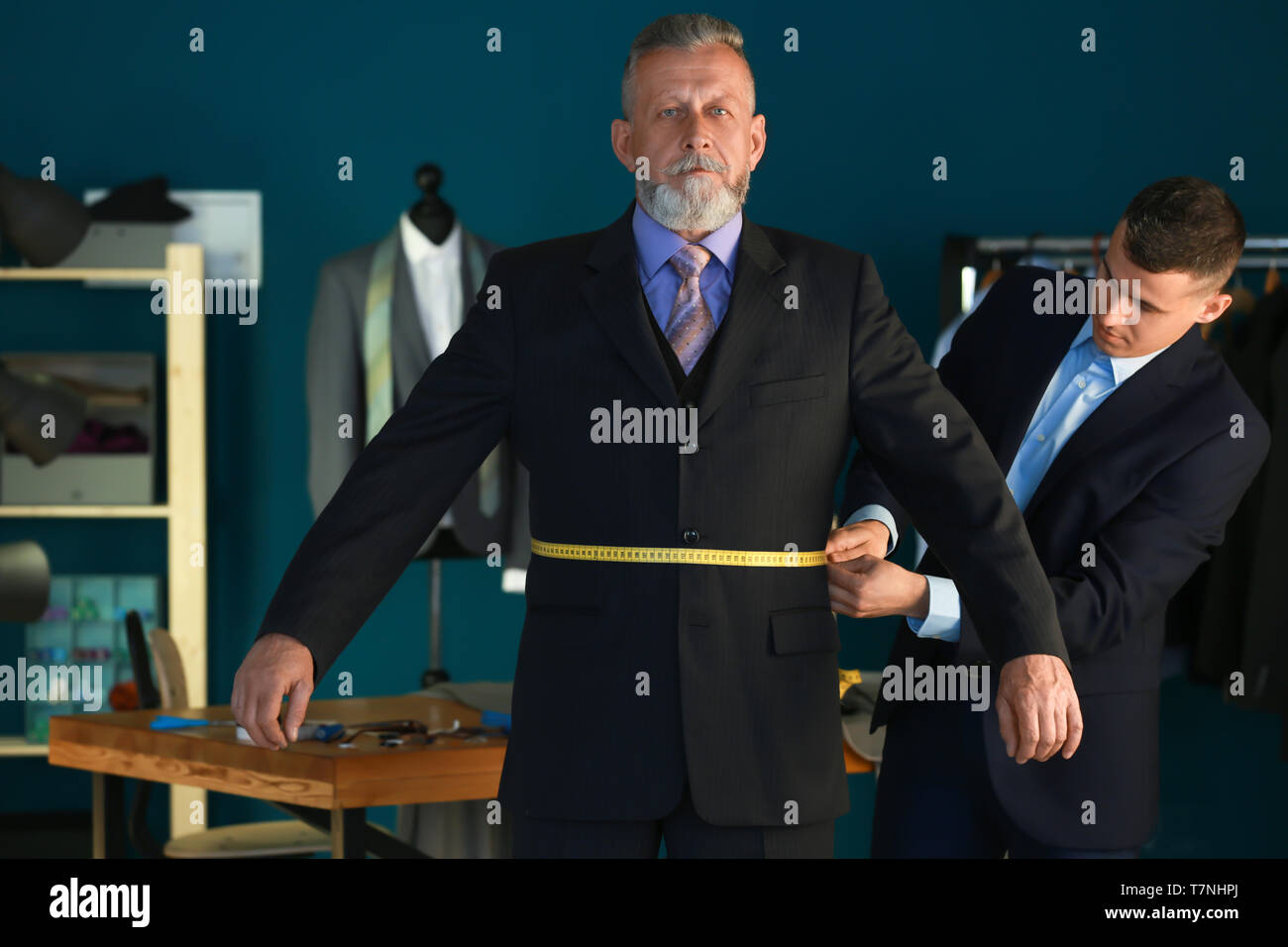Young man taking measurements hi-res stock photography and images - Alamy