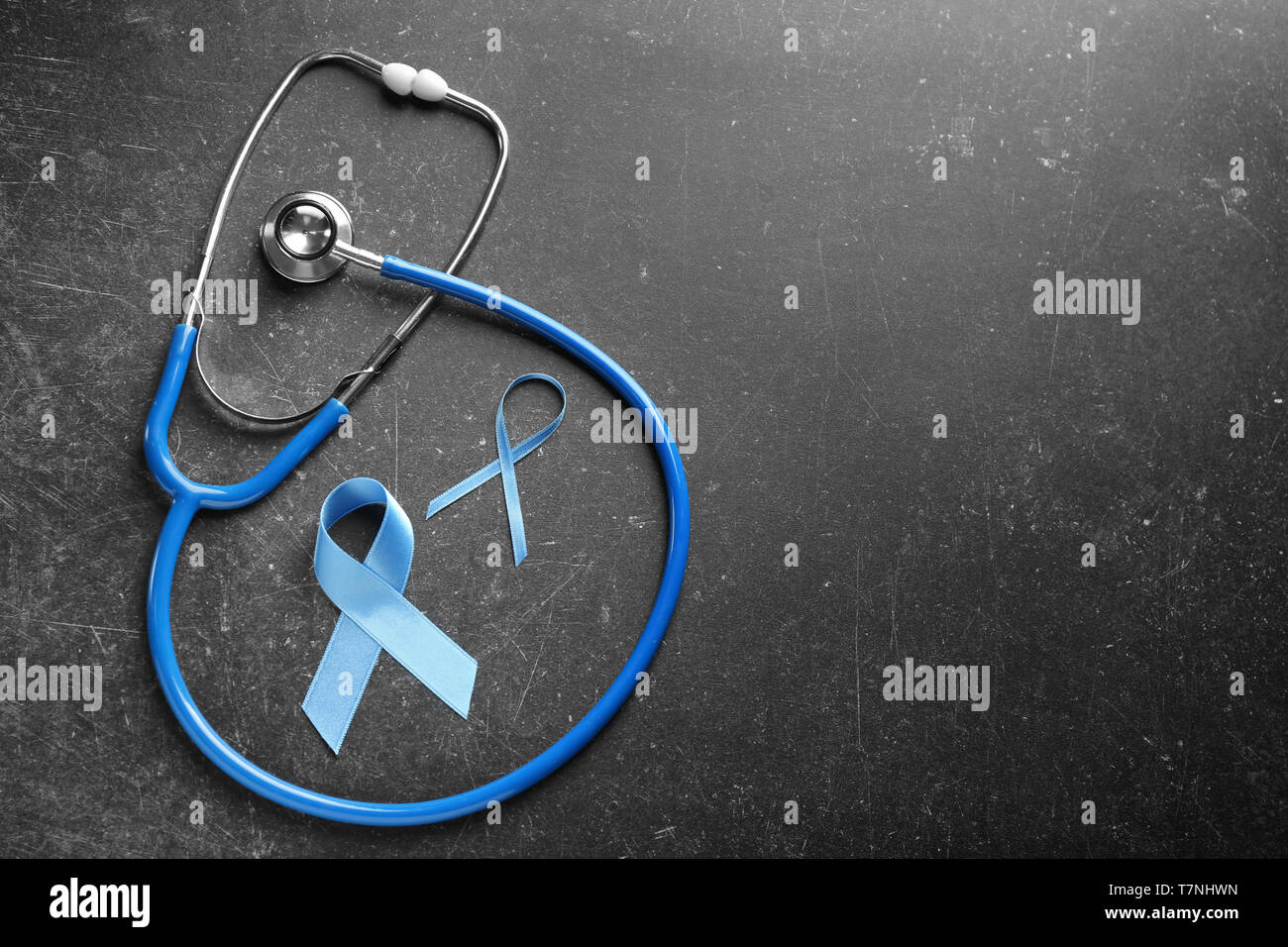 Blue ribbons and stethoscope on dark background. Prostate cancer ...