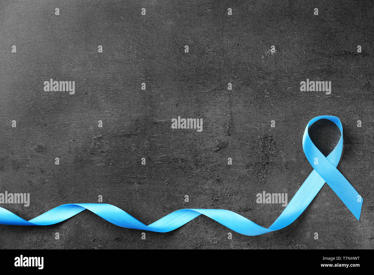 Blue ribbon on dark background. Prostate cancer concept Stock Photo - Alamy