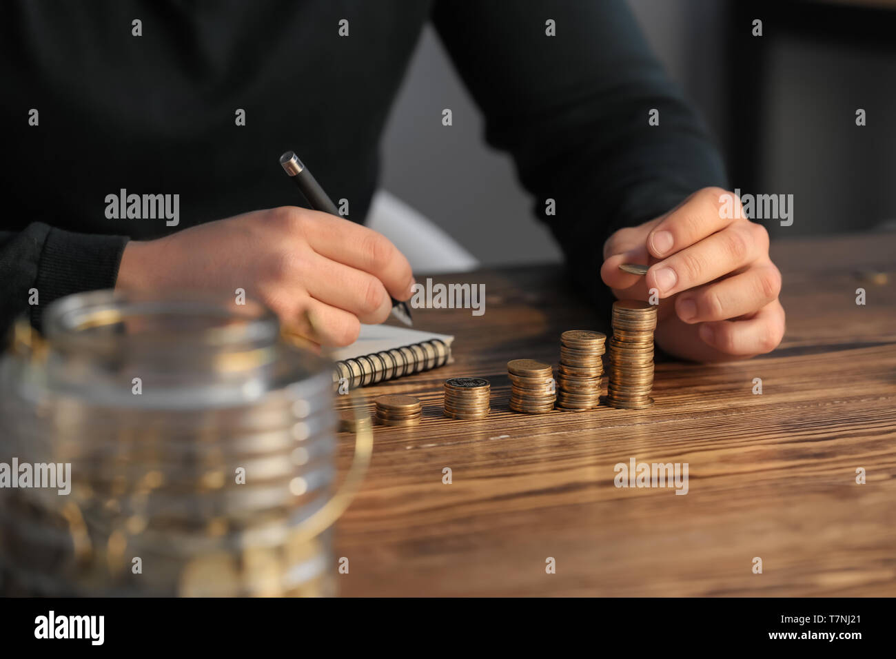 Man counting stacks of money hi-res stock photography and images - Alamy