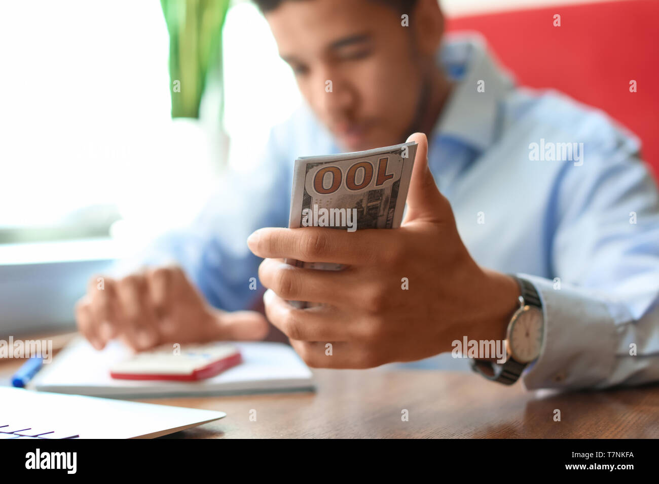 African man counting calculator hi-res stock photography and images - Alamy