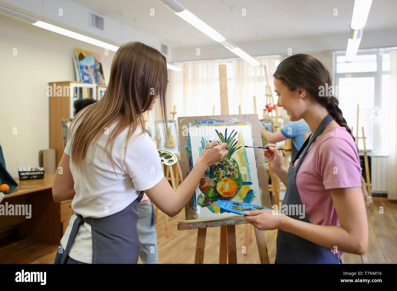 Female students painting still hi-res stock photography and images - Alamy
