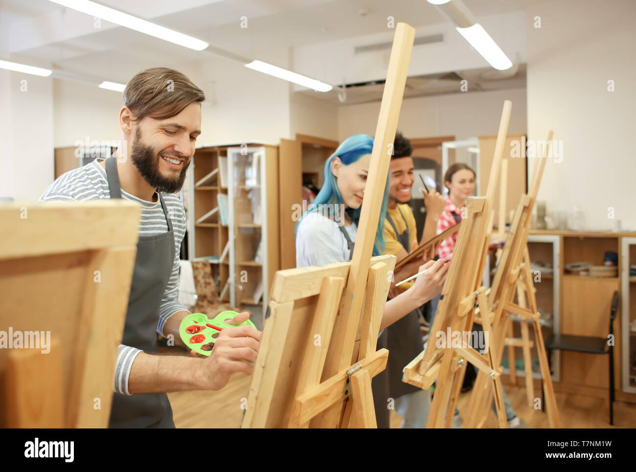 Art students painting in workshop Stock Photo - Alamy