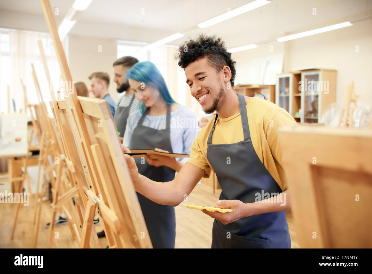Art students painting in workshop Stock Photo - Alamy