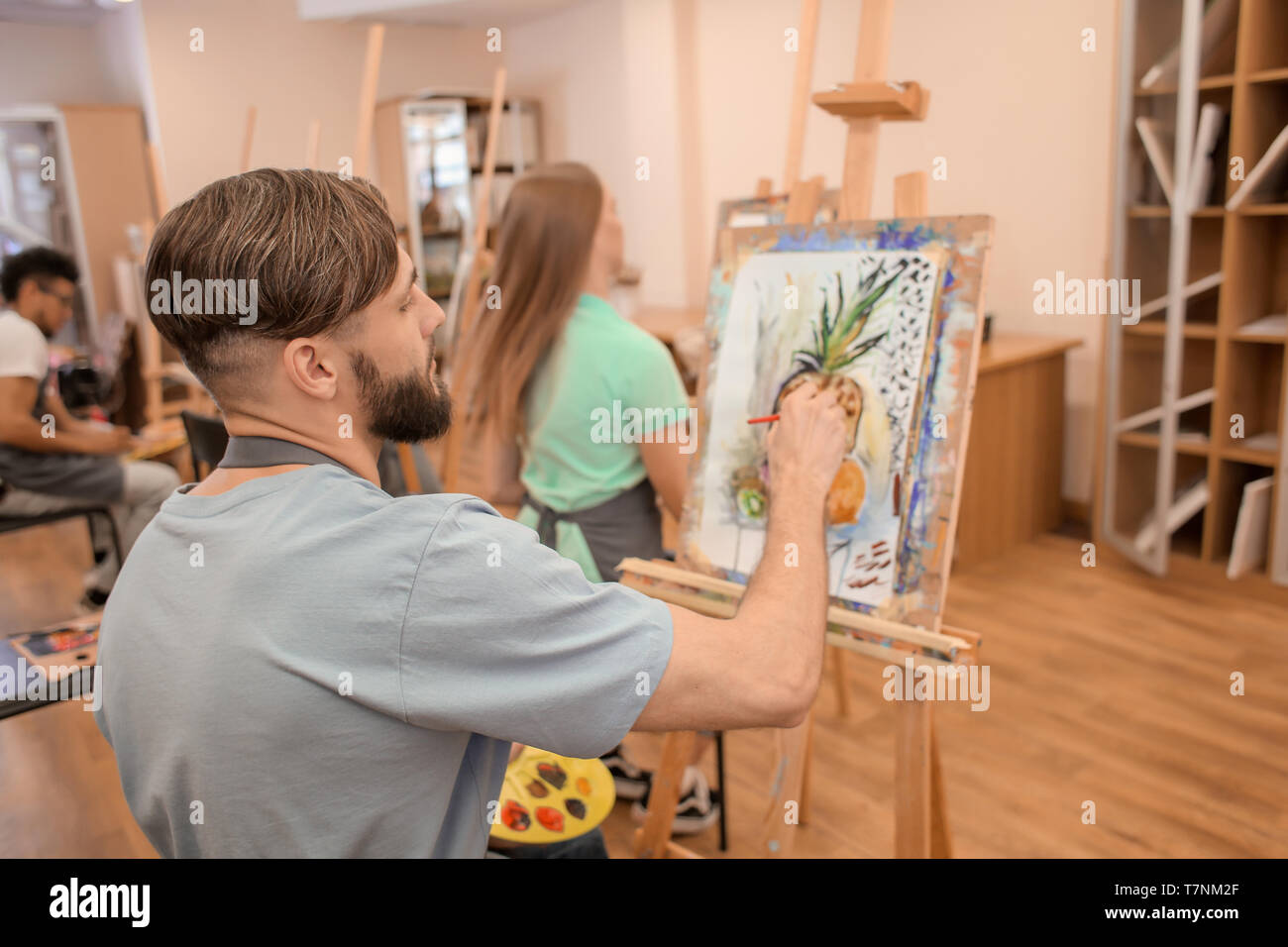 Male art student drawing at easel hi-res stock photography and images ...