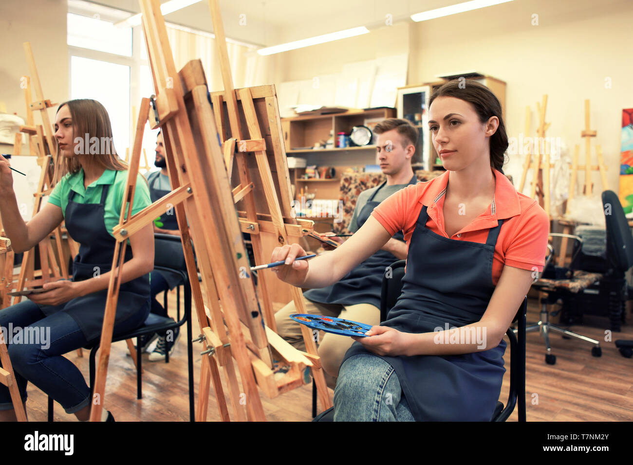 Art students painting in workshop Stock Photo - Alamy