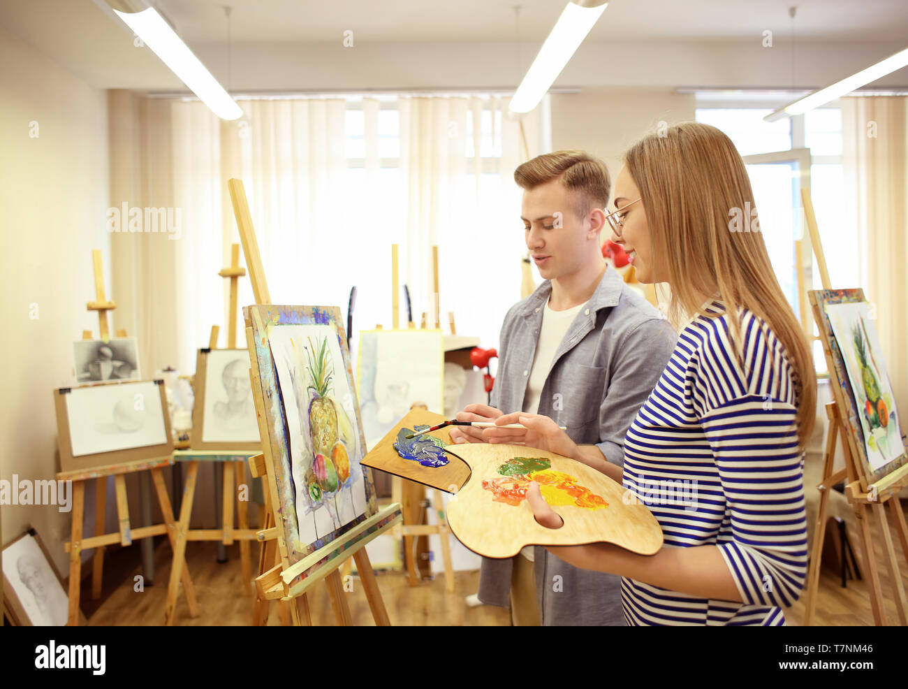 Art students painting in workshop Stock Photo - Alamy