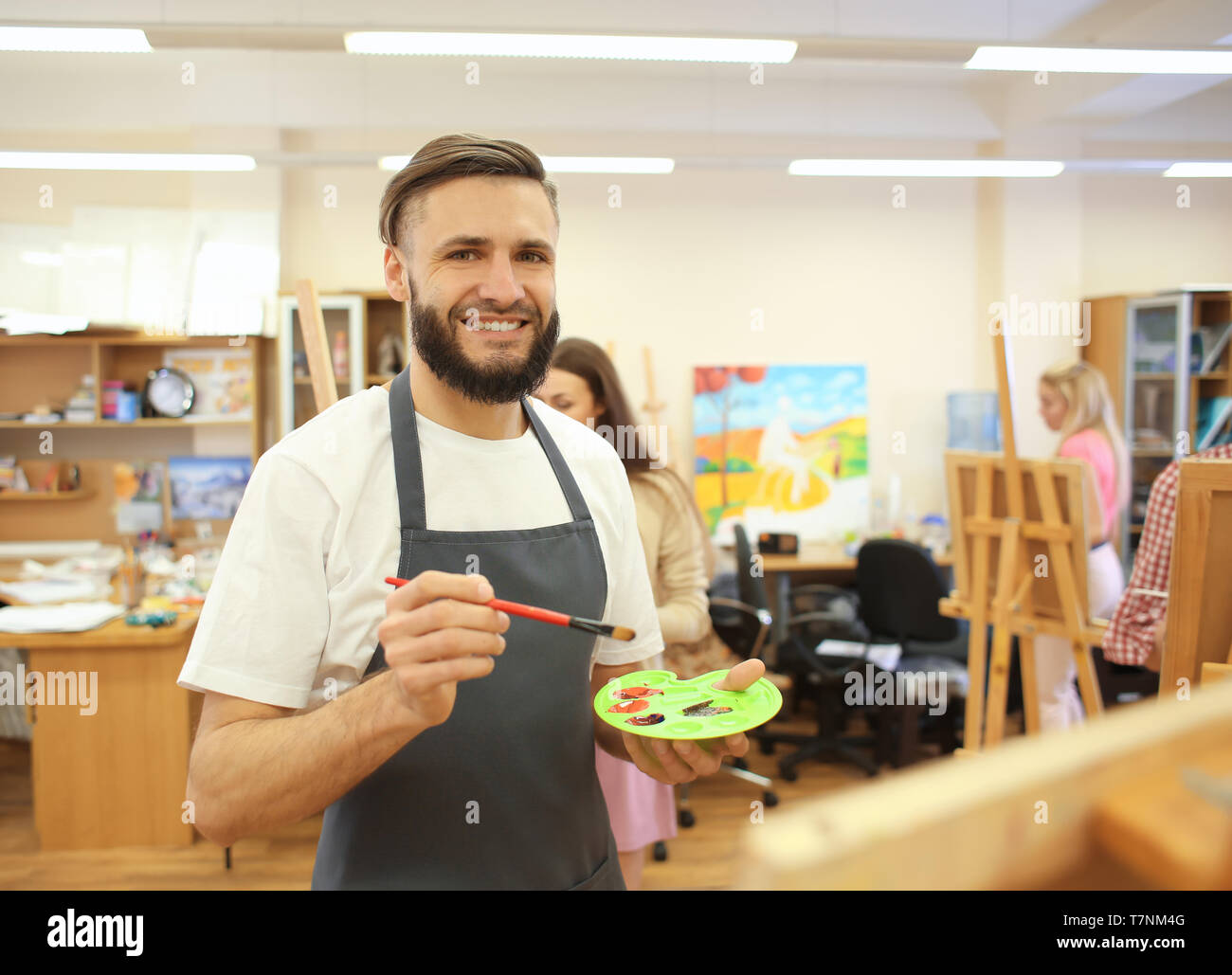 Male art student drawing at easel hi-res stock photography and images ...