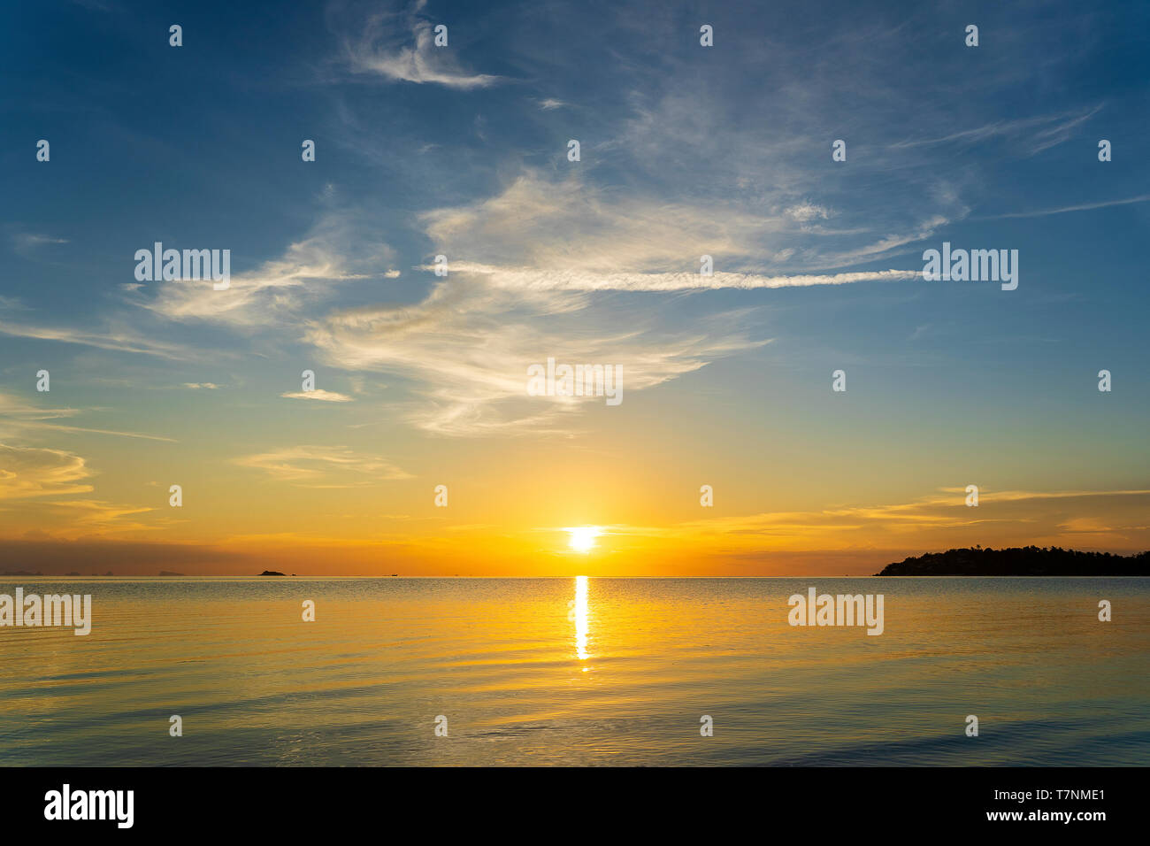 Colorful sunset over calm sea water near tropical beach. Summer ...