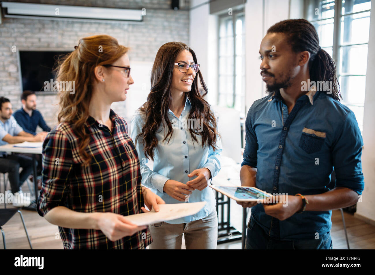 Portrait of architects having discussion in office Stock Photo - Alamy
