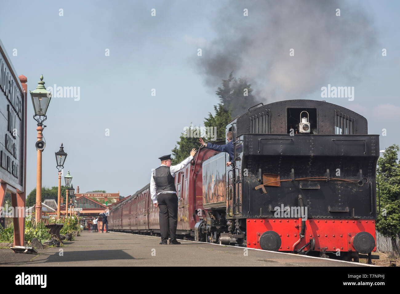 Rear view of vintage UK steam locomotive by platform at Kidderminster ...