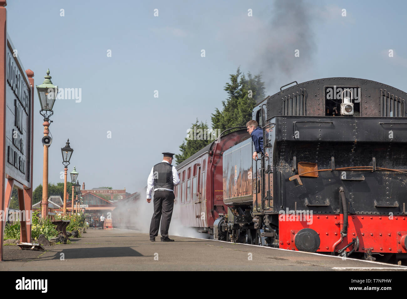 Rear view of vintage UK steam locomotive by platform at Kidderminster SVR heritage railway ...