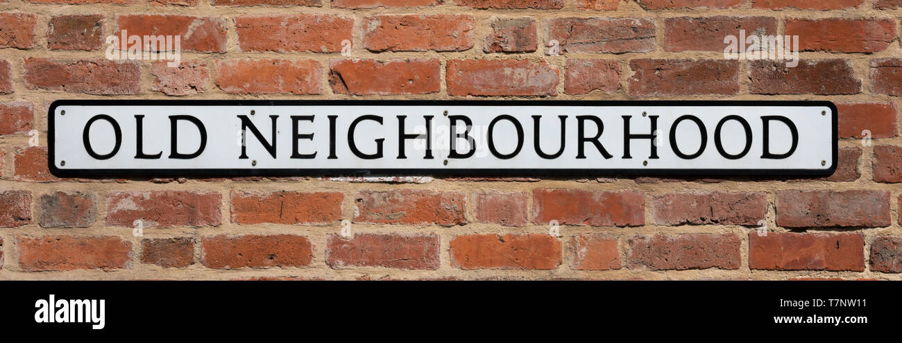 Old Neighbourhood street sign brick background Stock Photo - Alamy